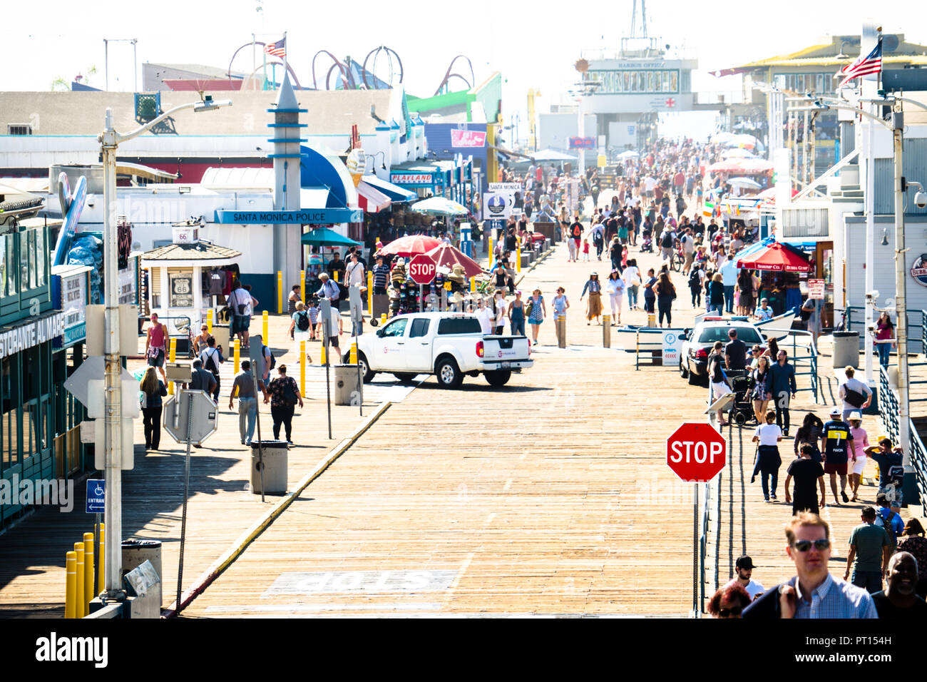 Santa Monica, CA: The busy crowded boardwalk at the Santa Monica Pier ...