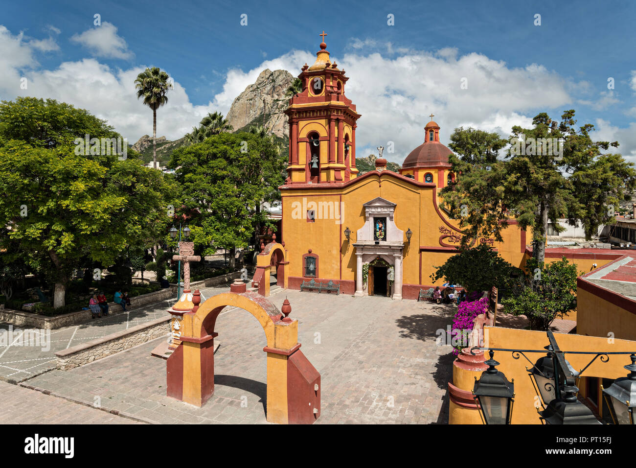 The Parroquia San Sebastian church with the massive monolith rock ...