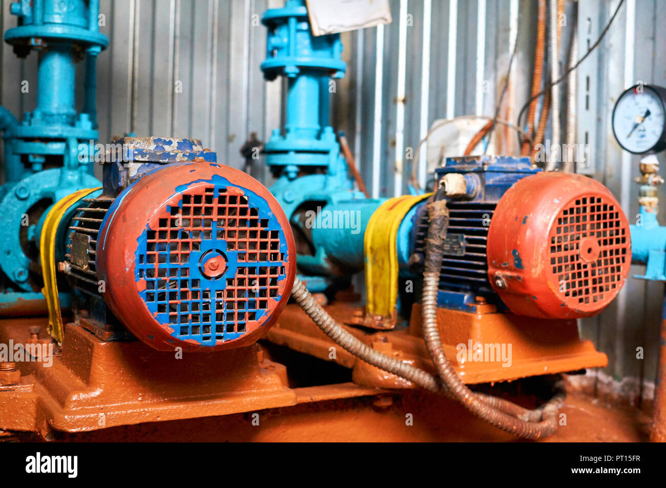 Old electric motor to the pump, valve and pressure gauge on the ...