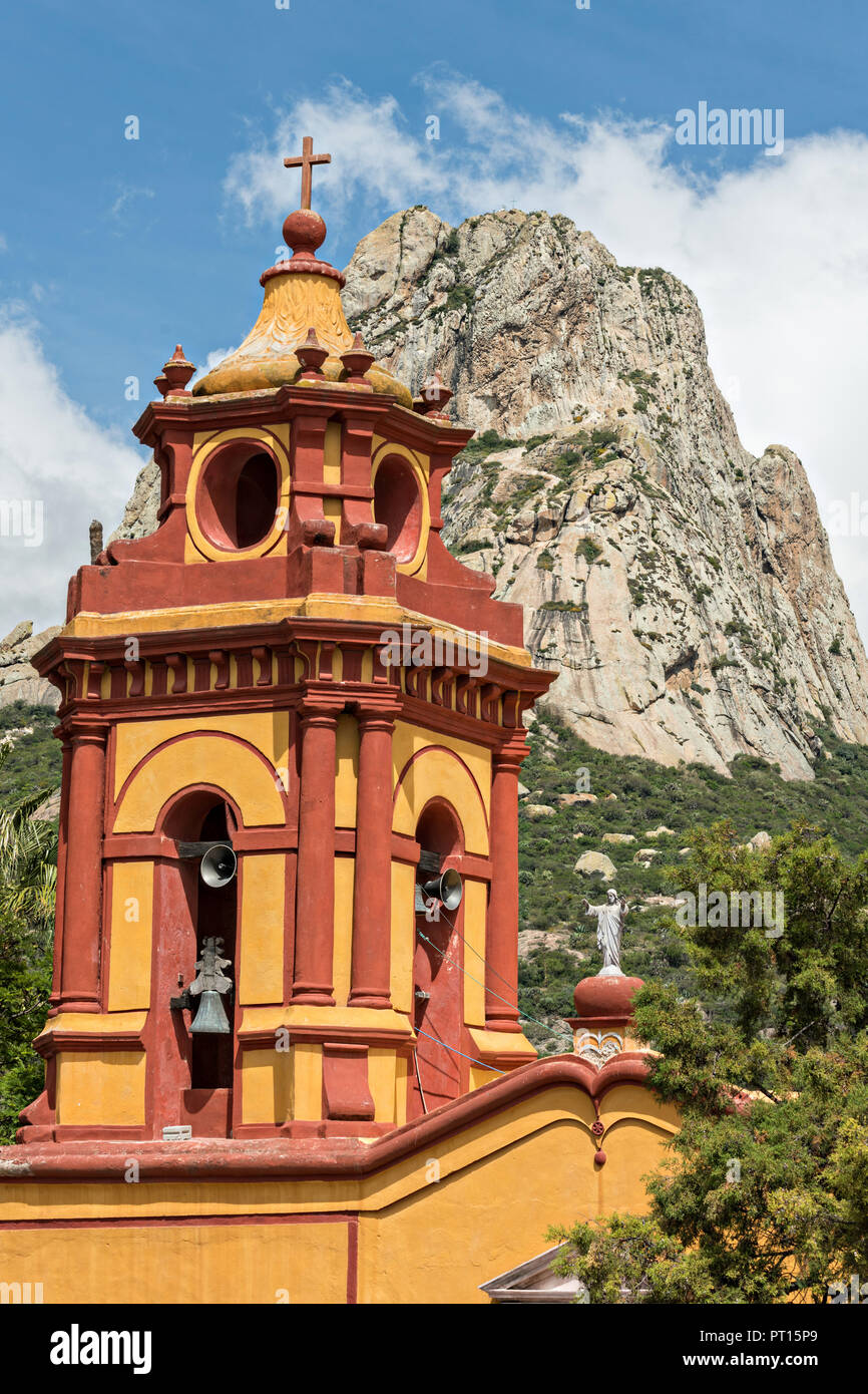 The Parroquia San Sebastian church with the massive monolith rock ...