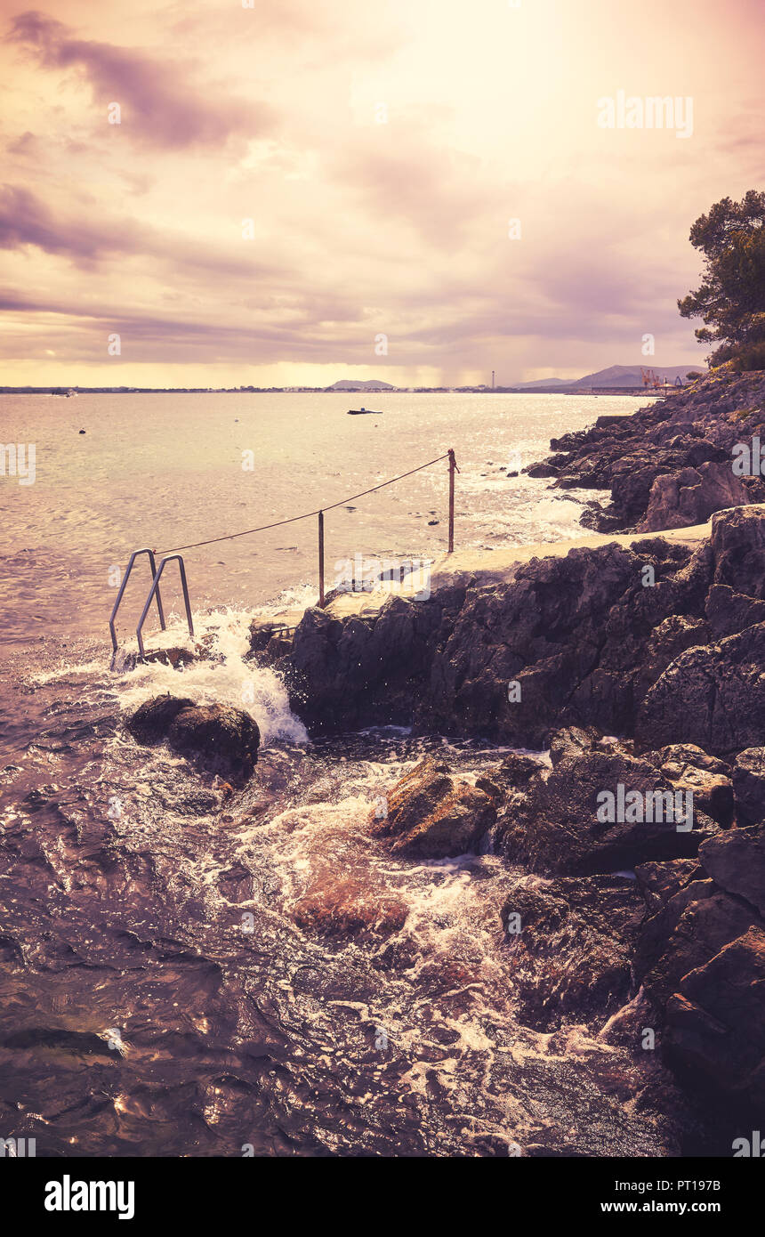 Path ended with sea ladder at sunset, color toning applied, Mallorca ...