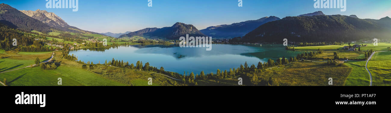 Austria, Tyrol, Kaiserwinkl, Aerial view of lake Walchsee, panorama ...
