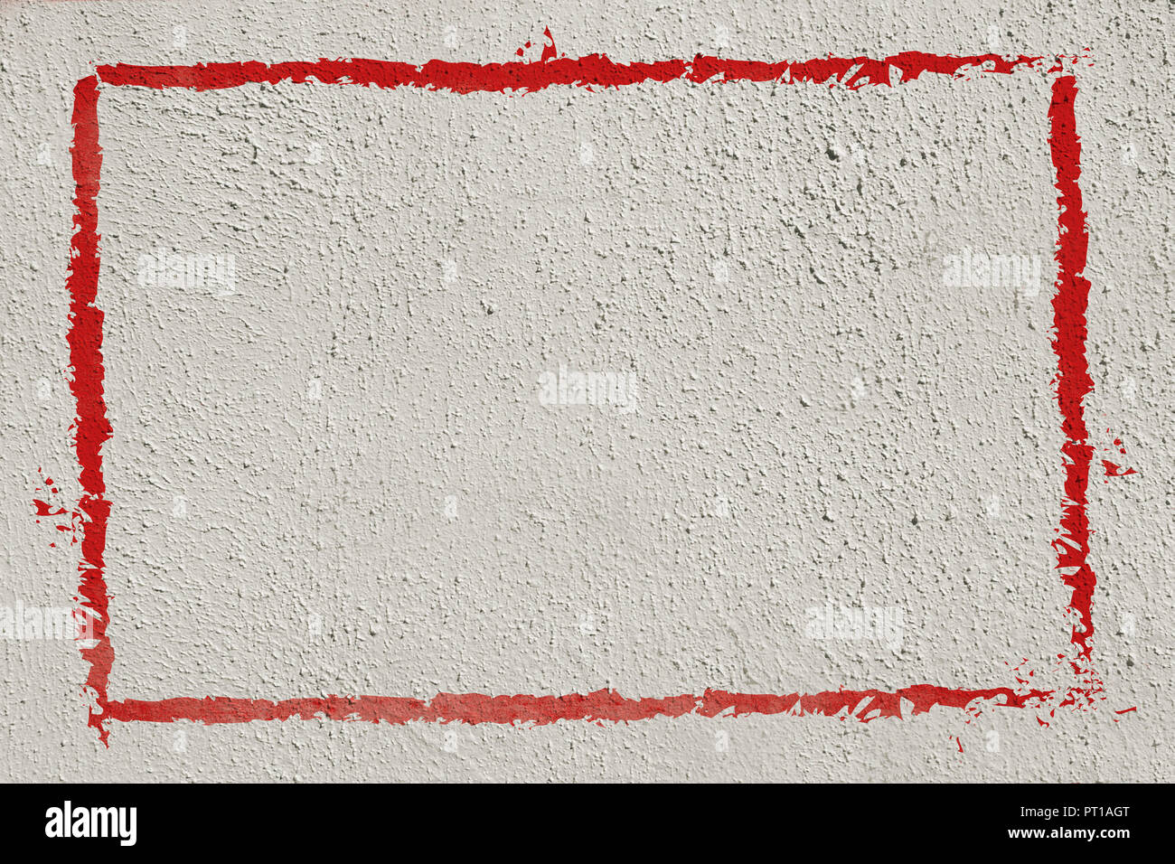 Thick red graffiti painted frame border on whitewashed concrete wall ...