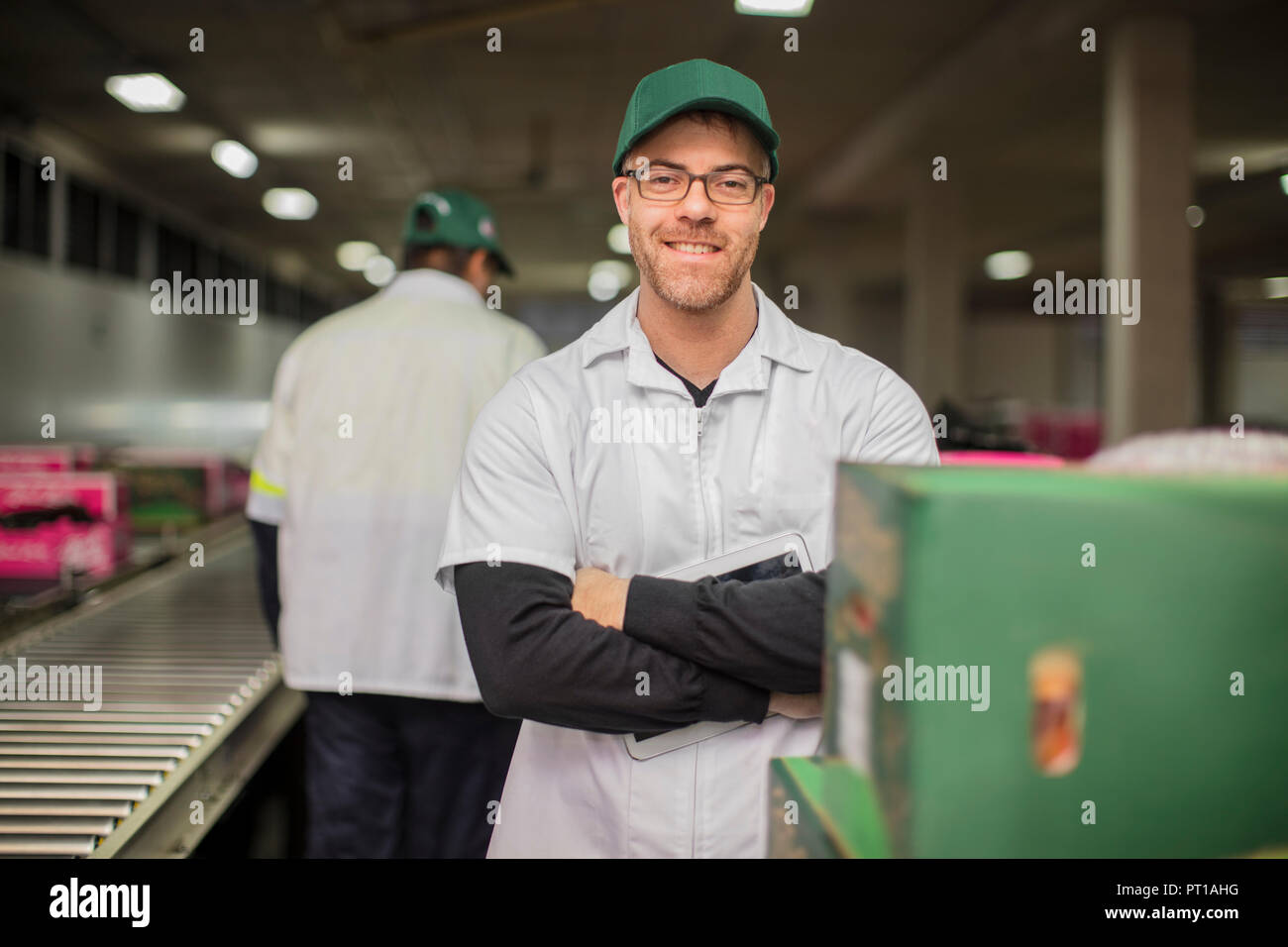 Workers in apple factory Stock Photo - Alamy