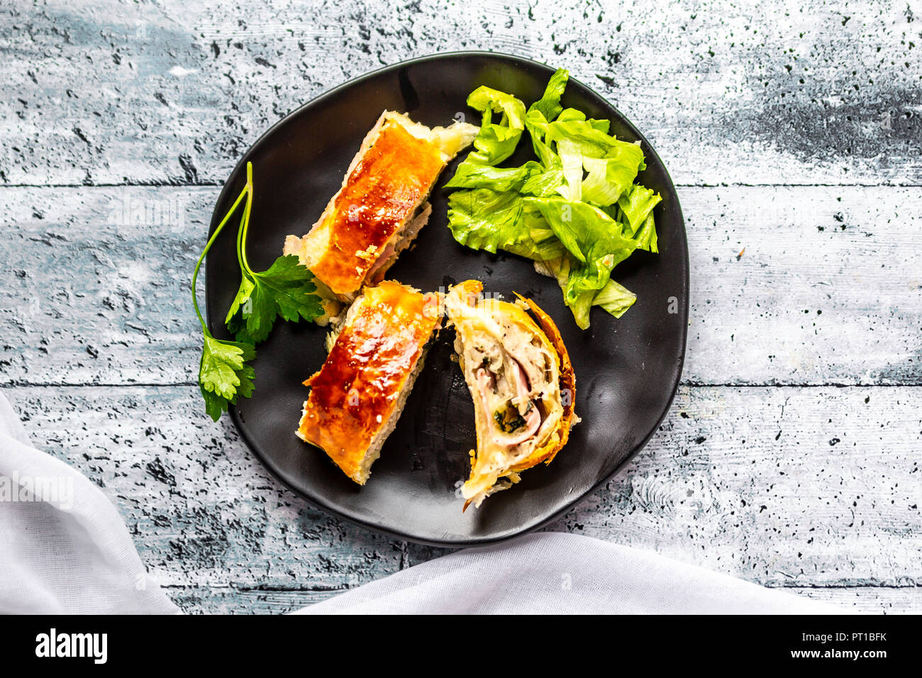 Swiss roll, puff pastry with sausage meat, cheese, onion, parsley and ...