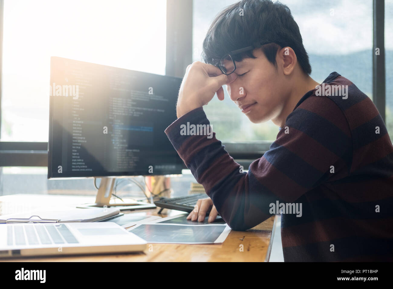 Young modern stressed programmer businessman a brake from working with ...