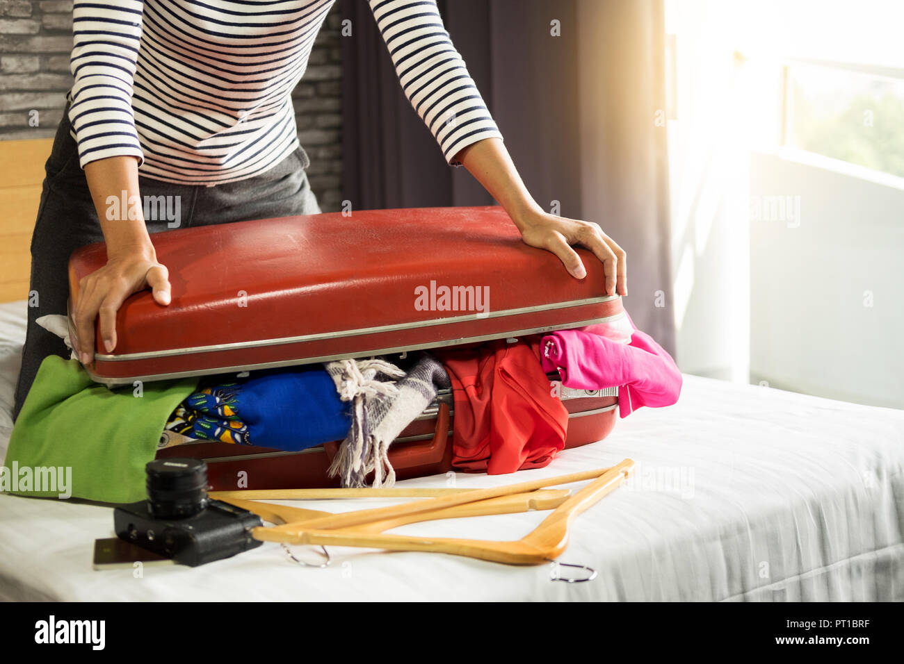Suitcase Overflowing Clothes High Resolution Stock Photography and ...