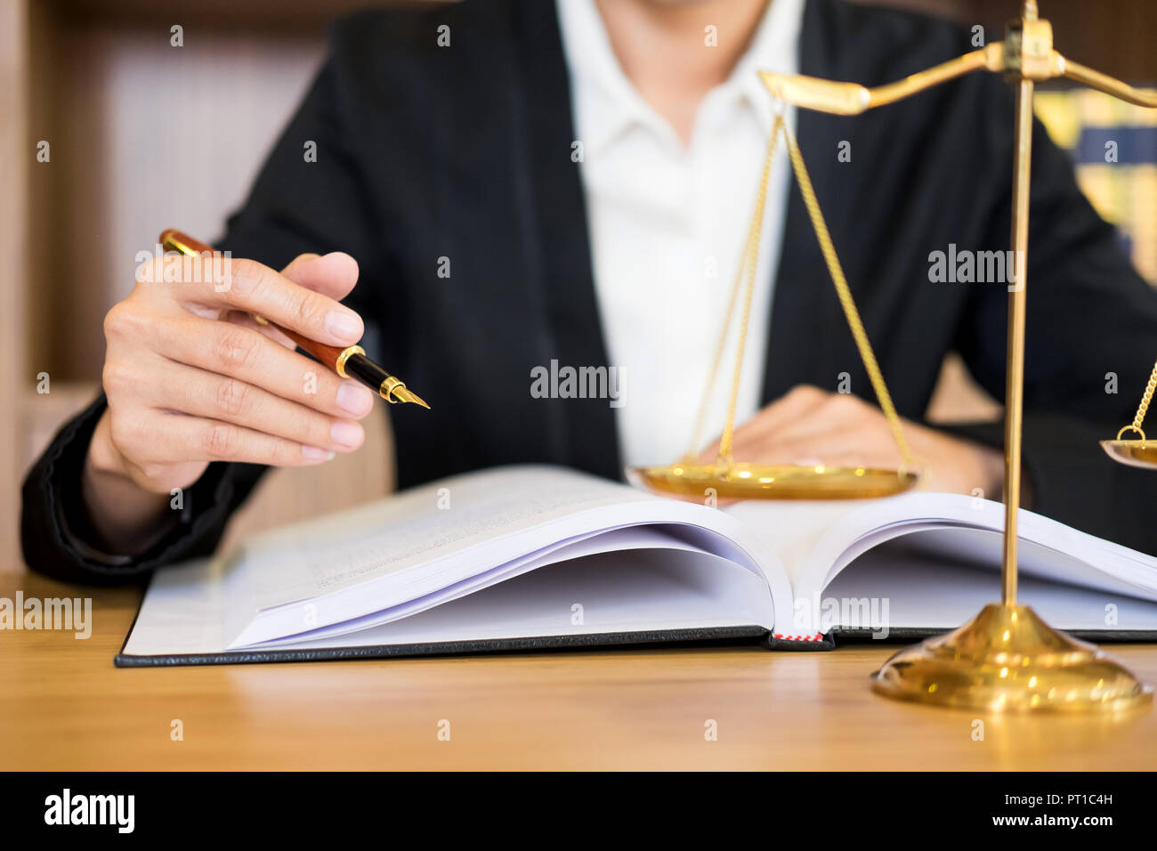 lawyer judge reading documents at desk in courtroom working on wooden ...