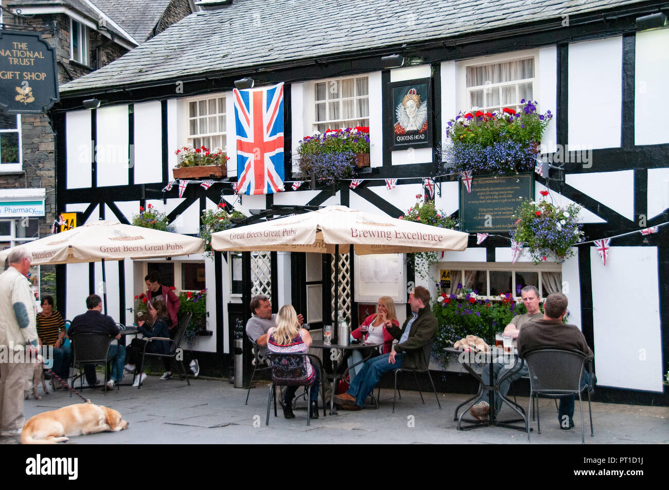 Eating and sitting outside the tudor style, black and white, Queens ...