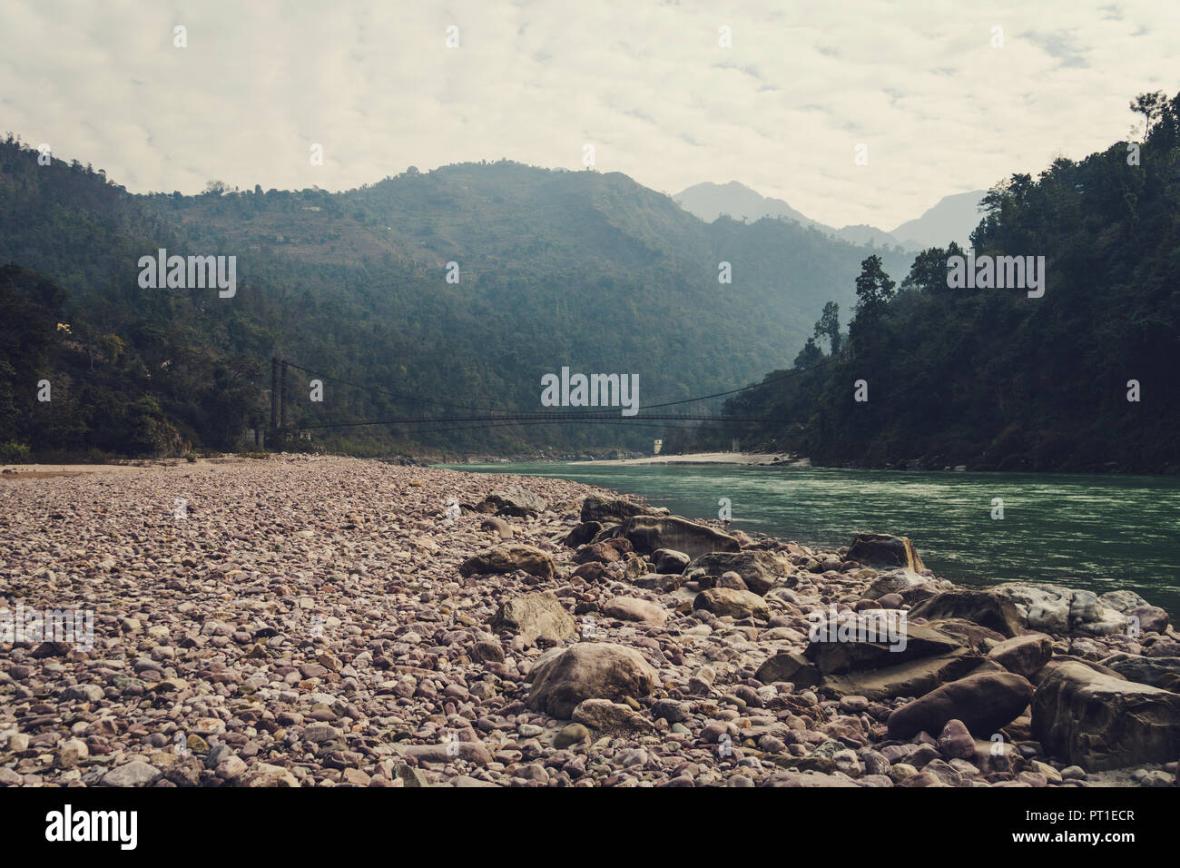 A beautiful landscape in the mountains with a bridge over the Ganges ...