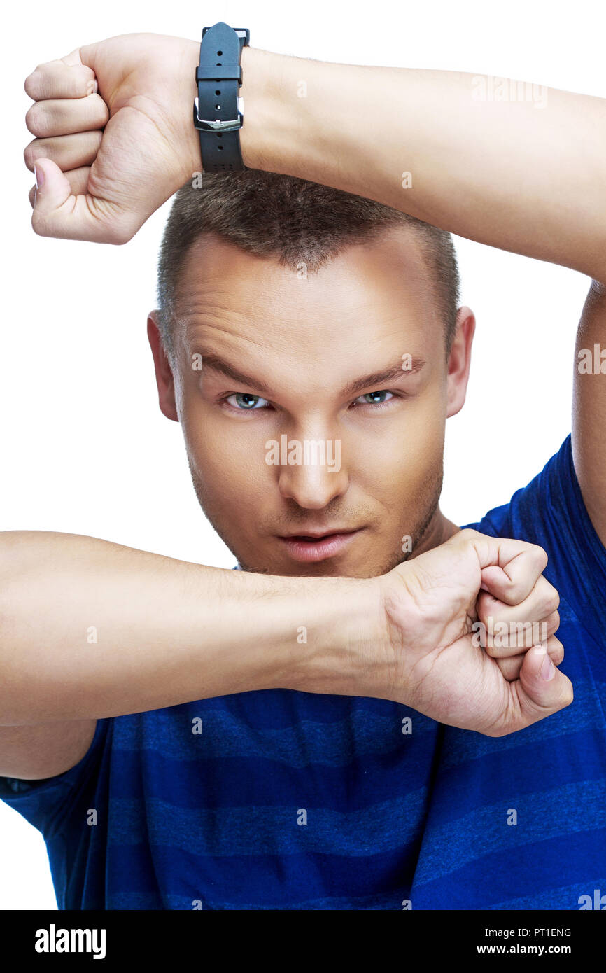 portrait of a young man with arms near face isolated against white ...