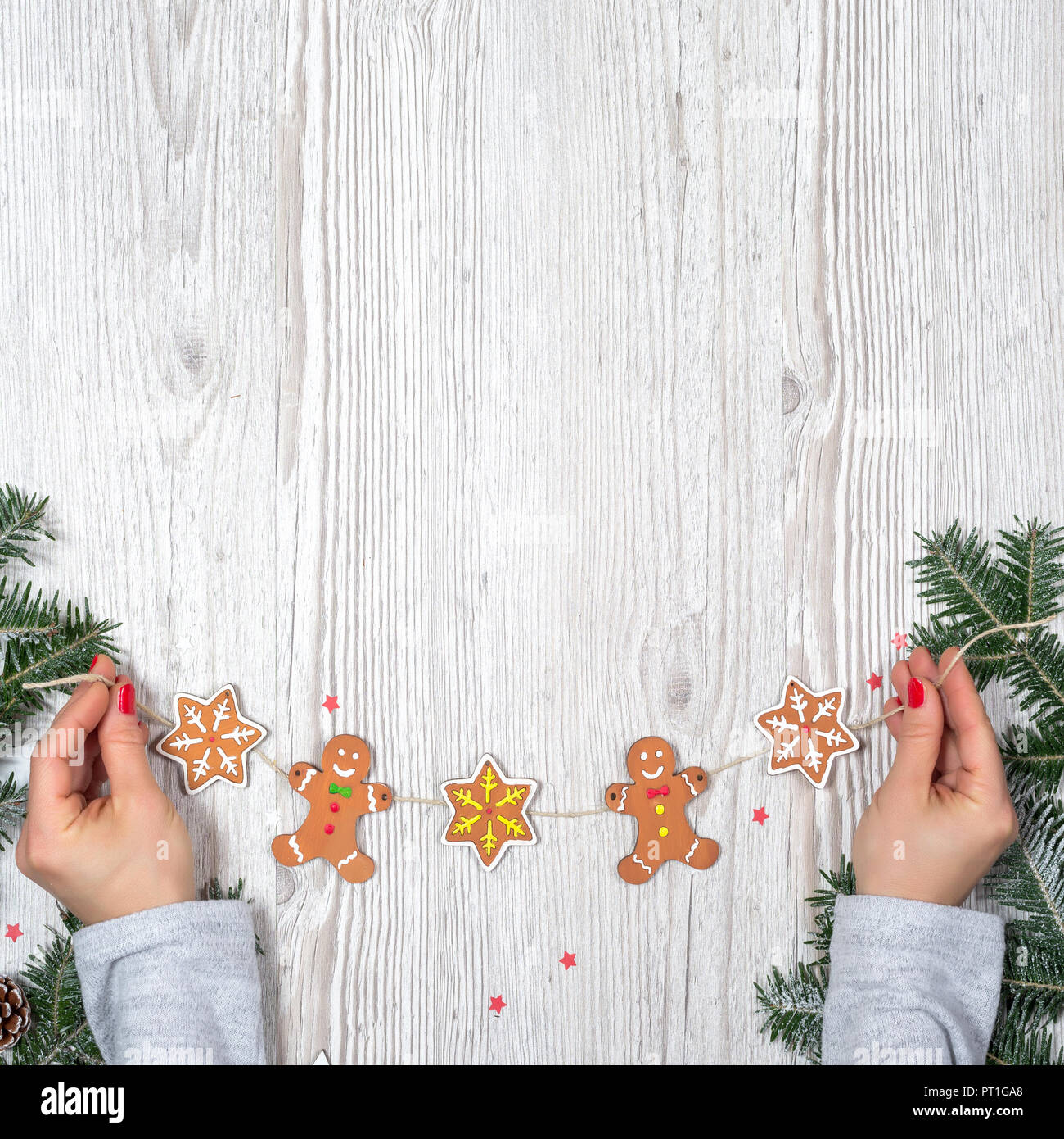 Gifts in hands with Christmas background Stock Photo - Alamy