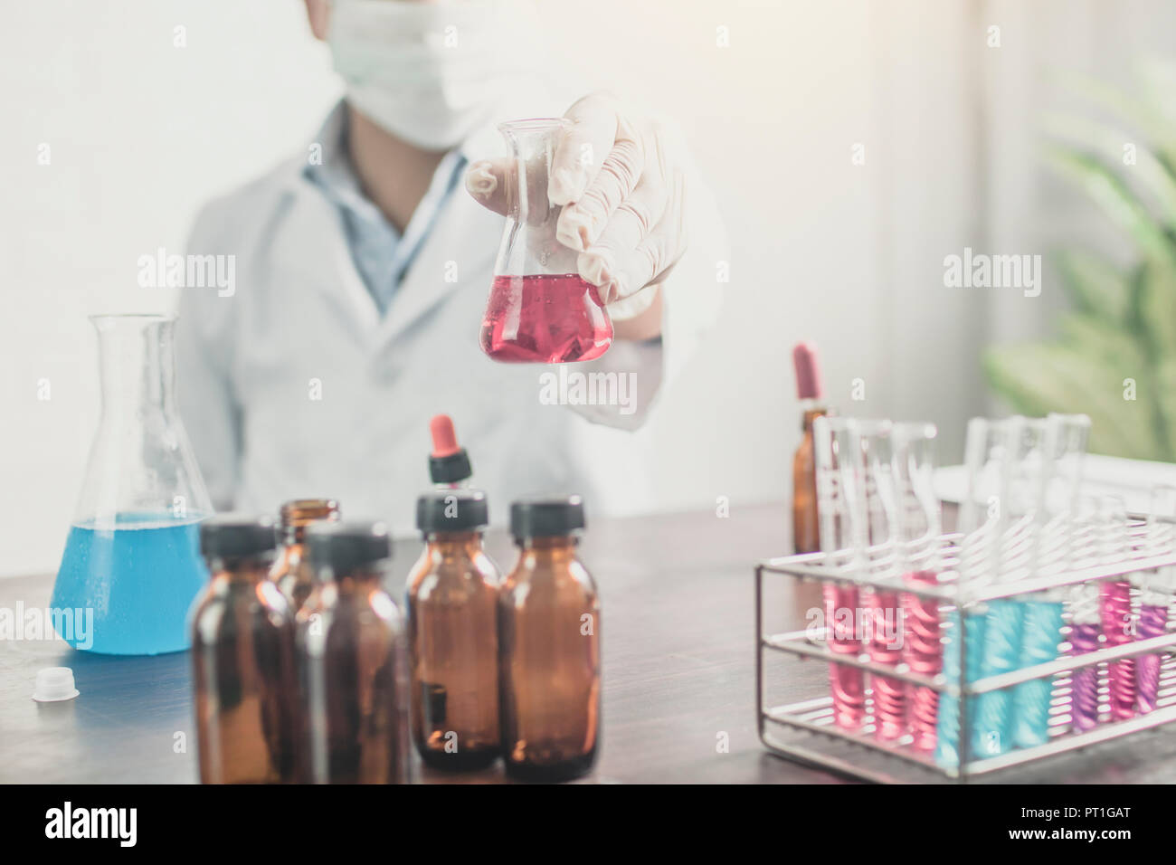 Experiment or scientist holding test tube in science lab Stock Photo ...
