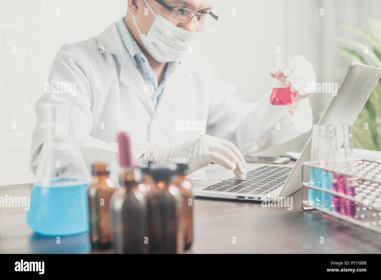 Scientist holding glass water in hi-res stock photography and images ...