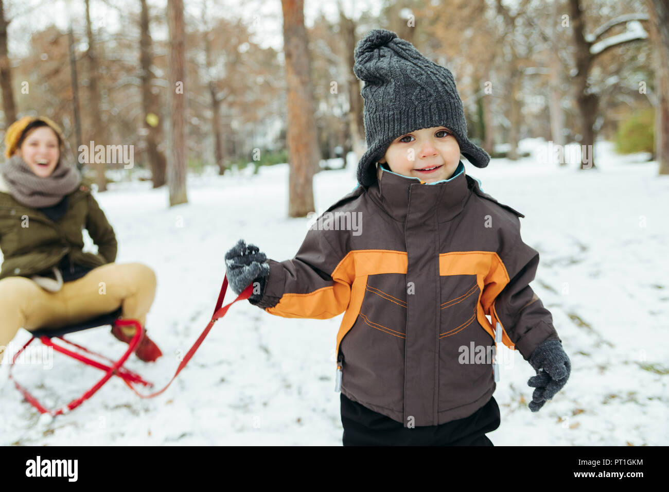 Portrait of little boy in the snow Stock Photo - Alamy