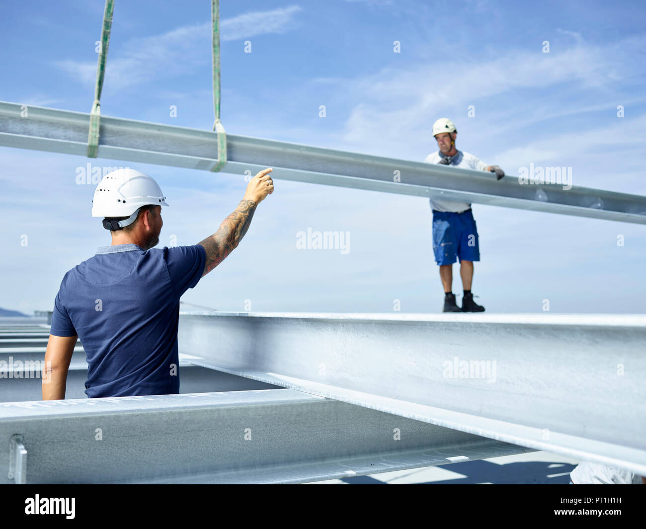 Worker construction site standing steel girder hi-res stock photography ...
