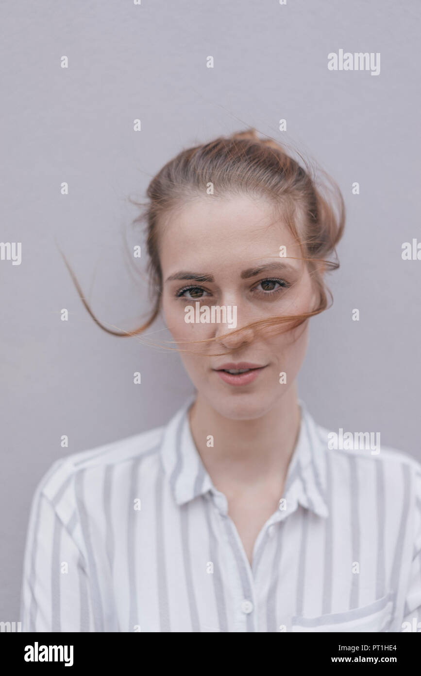 Portrait of a pretty woman with windswept hair Stock Photo - Alamy