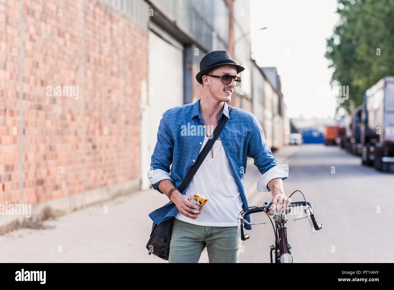 Young man on cycle hi-res stock photography and images - Alamy