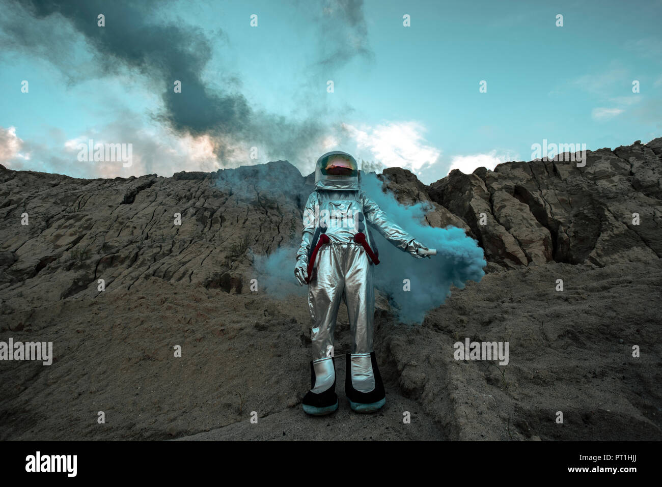 Abandoned spaceman giving smoke signals Stock Photo - Alamy