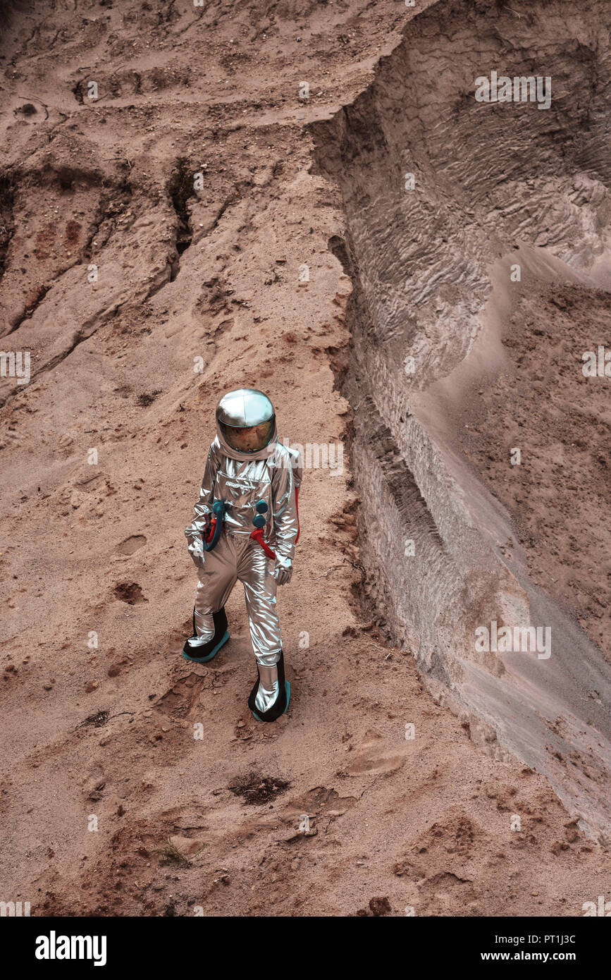 Spaceman exploring nameless planet Stock Photo - Alamy