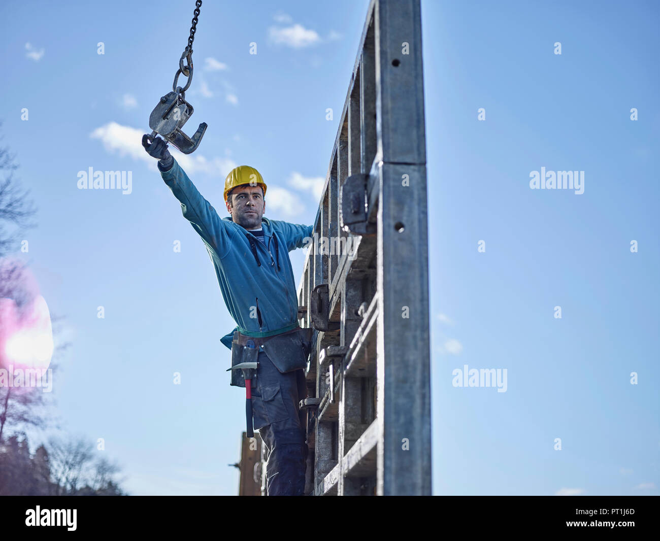 Construction worker reaching hook crane hi-res stock photography and ...