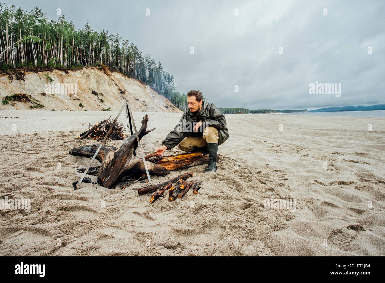 Collecting wood beach hi-res stock photography and images - Alamy