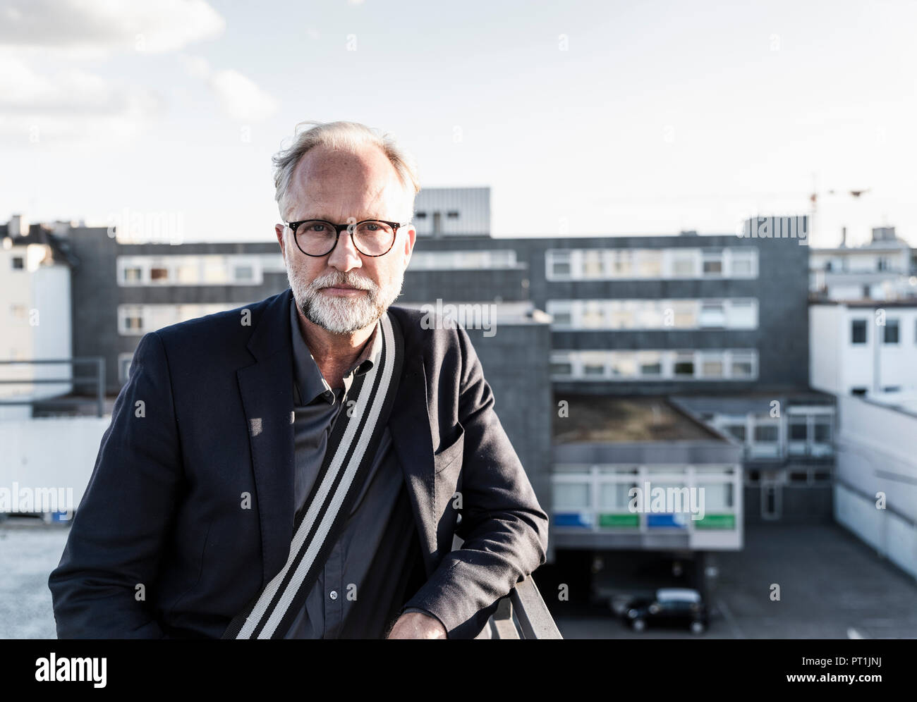 Mature man standing rooftop hi-res stock photography and images - Alamy