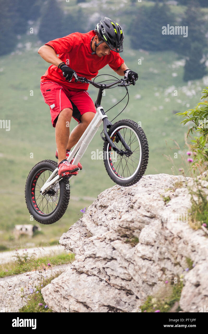 Acrobatic biker on trial bike Stock Photo - Alamy