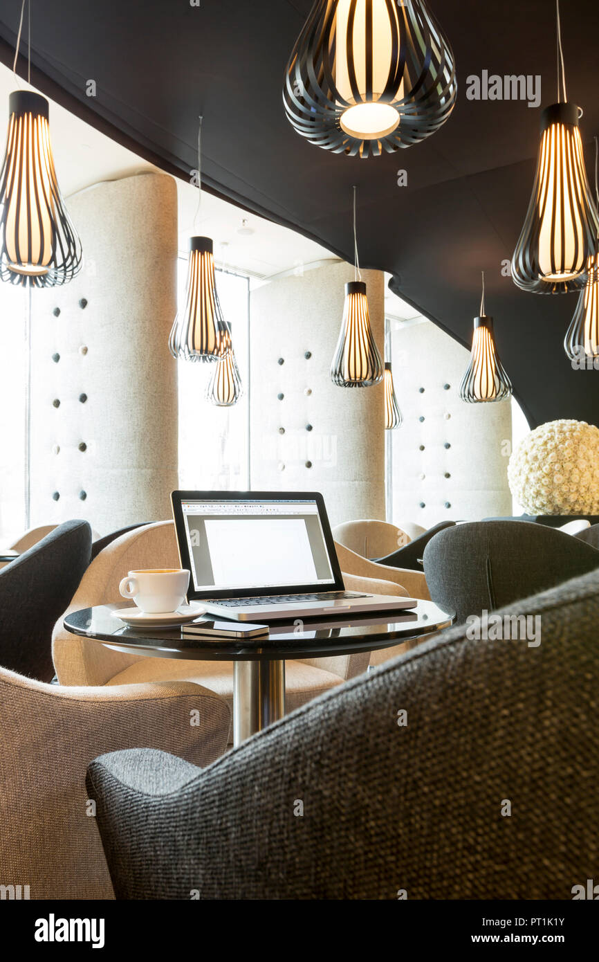 Laptop coffee cup lounge hotel hi-res stock photography and images - Alamy