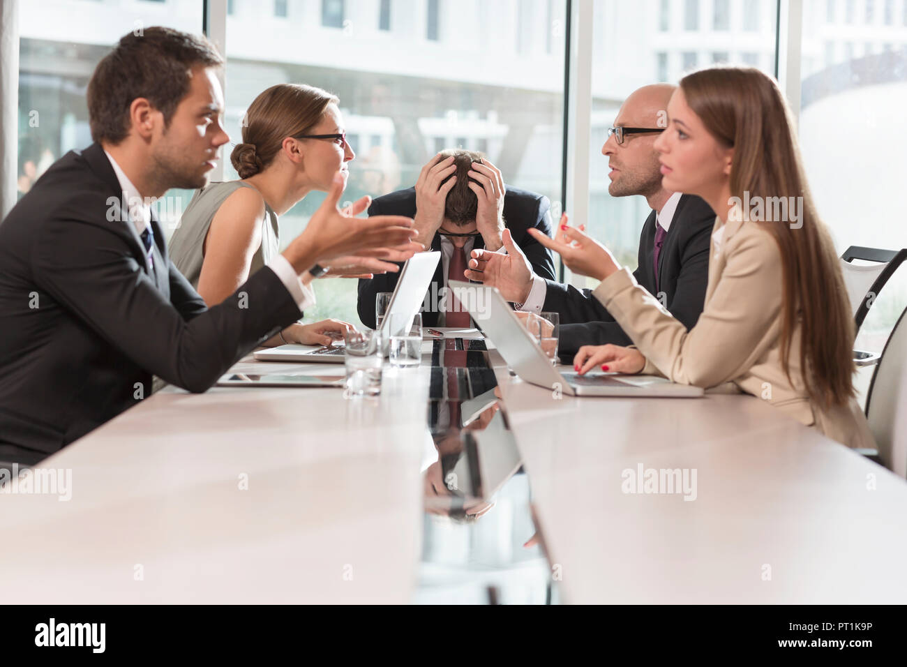 Five business people having an argument Stock Photo - Alamy