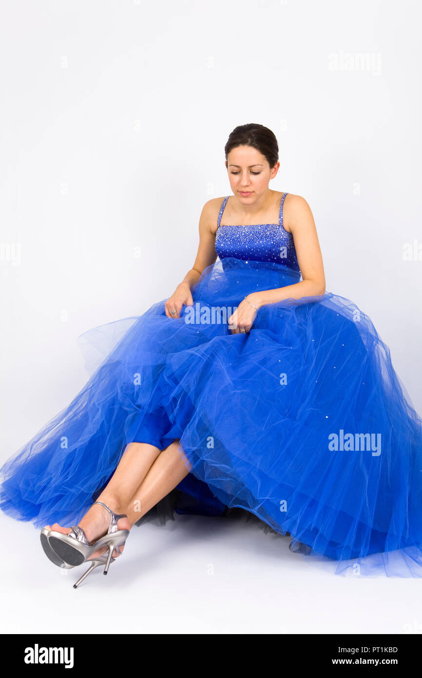 Beautiful young lady in blue prom dress Stock Photo - Alamy
