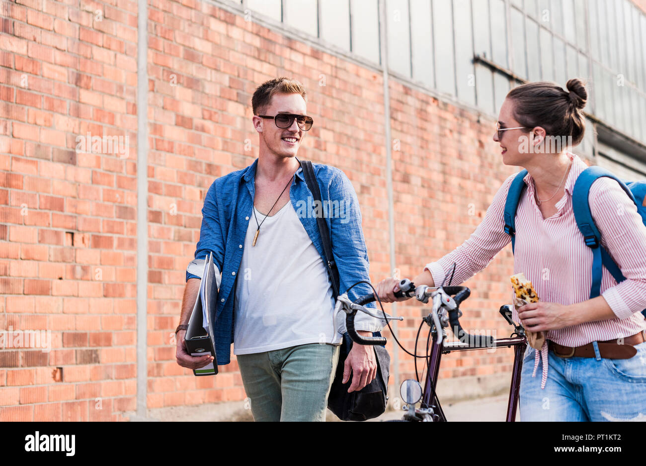 Young couple walking talking on hi-res stock photography and images - Alamy