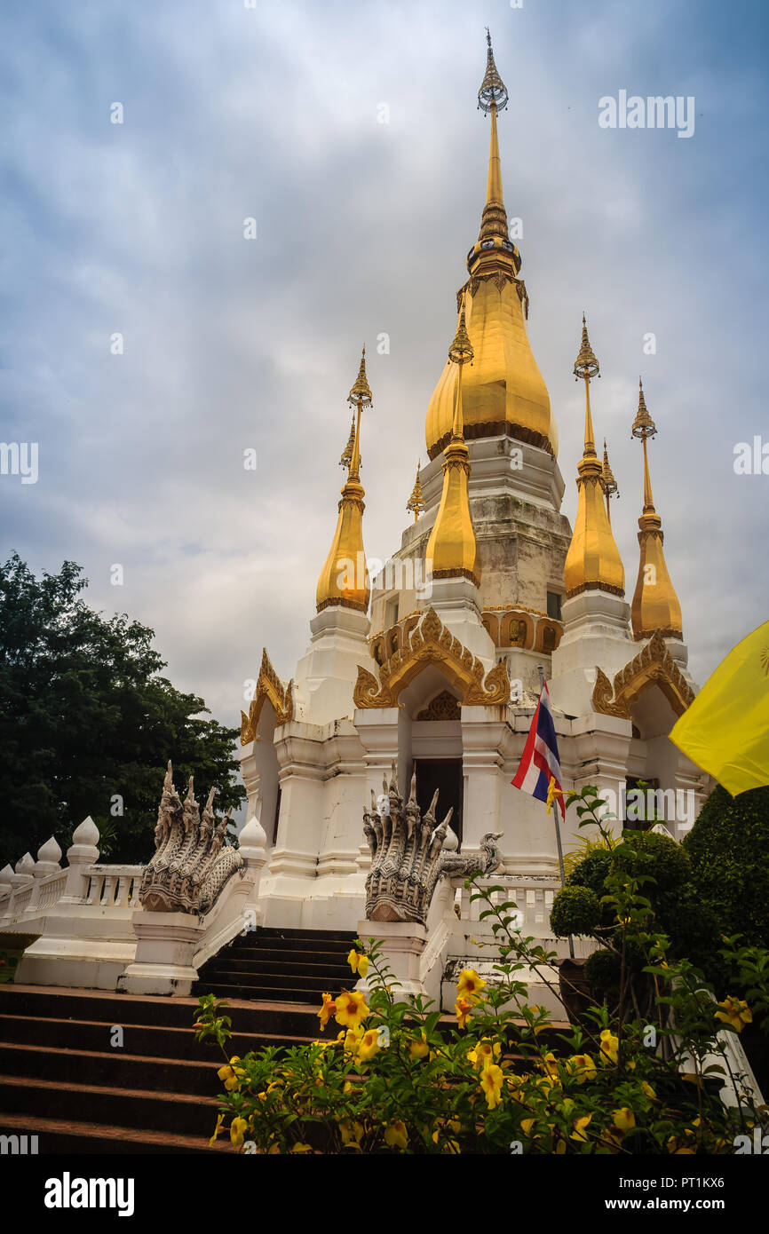 Beautiful golden pagoda with white clouds and blue sky background named ...