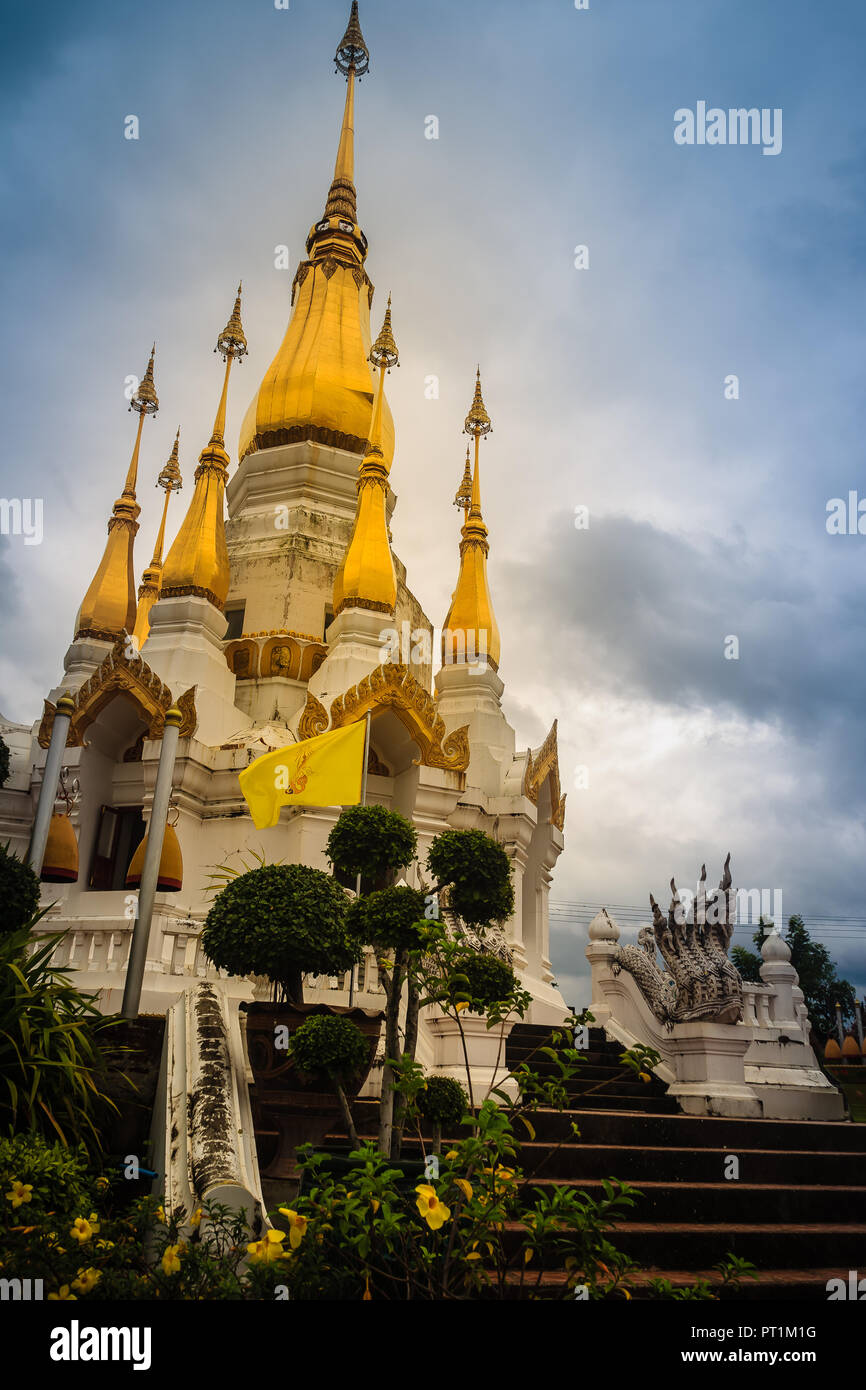 Beautiful golden pagoda with white clouds and blue sky background named ...