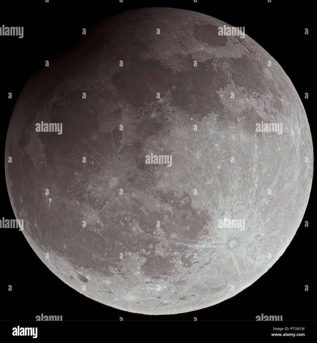 Full moon with partial eclipse Stock Photo - Alamy