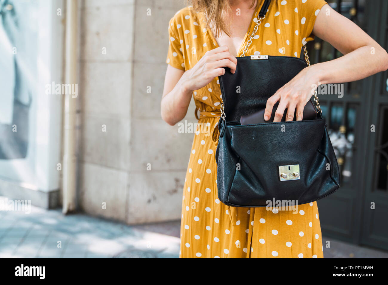 Woman searching bag hi-res stock photography and images - Alamy