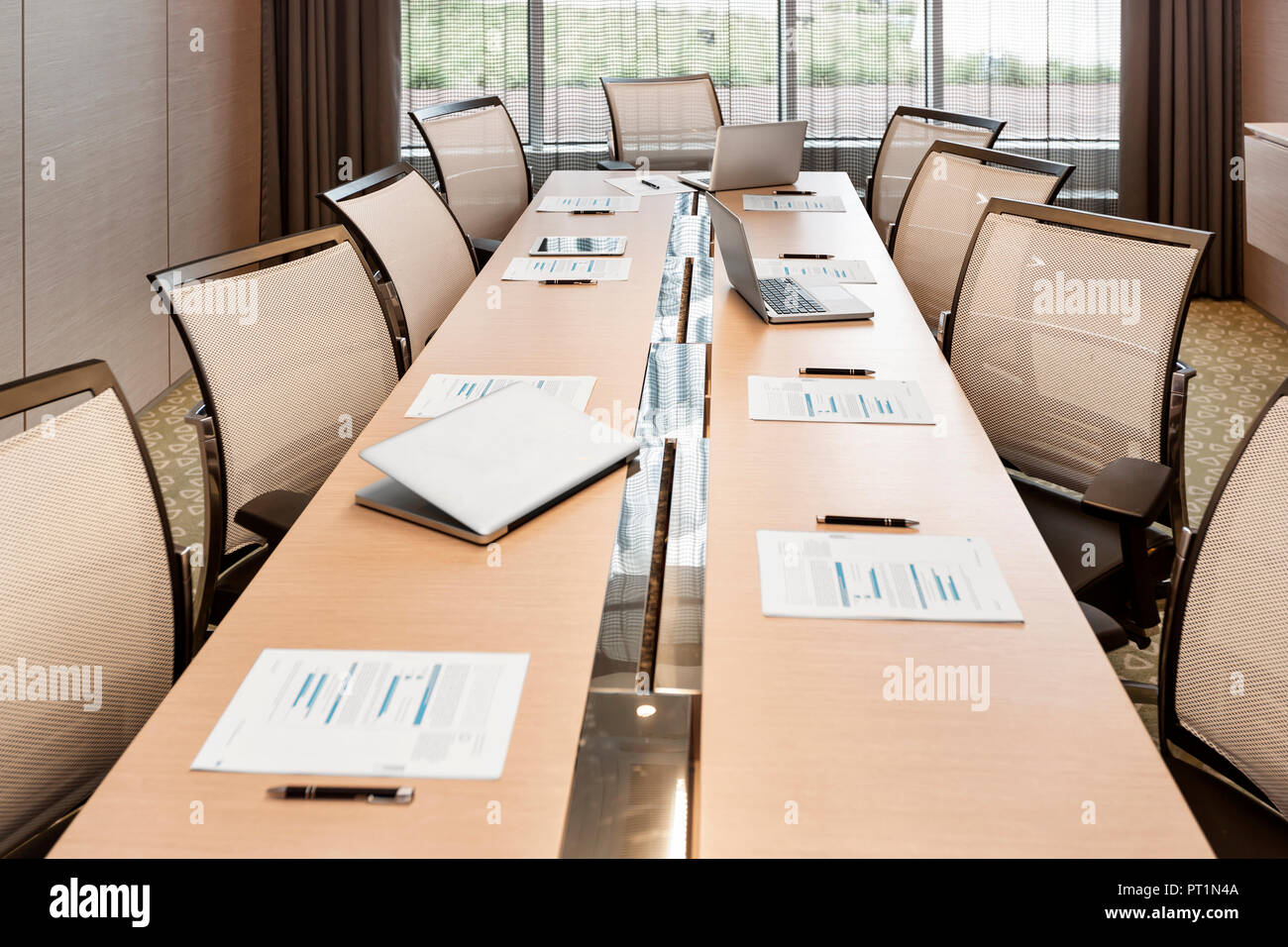 Papers laptop conference table hotel hi-res stock photography and ...