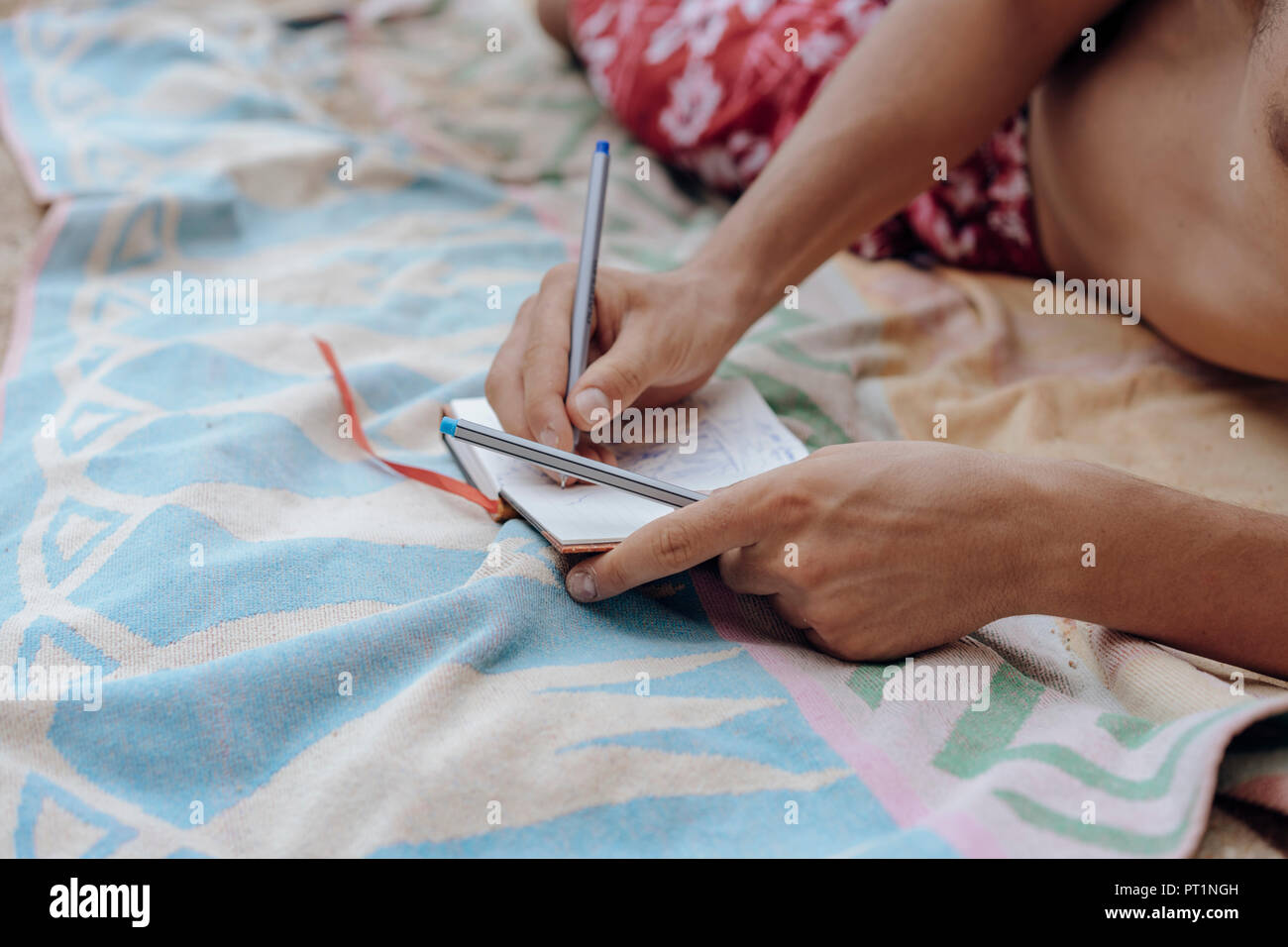 Man drawing in notebook Stock Photo - Alamy