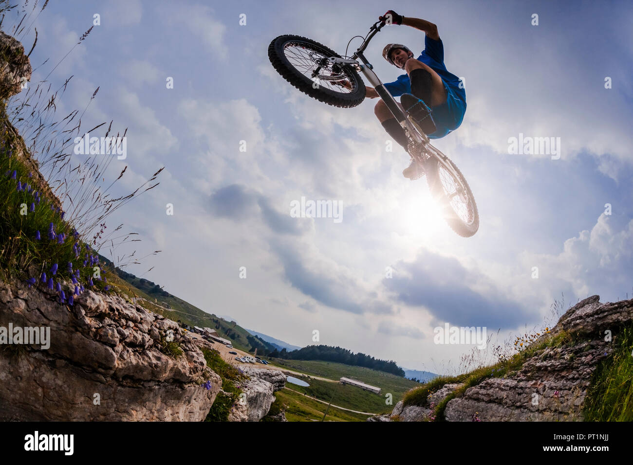 Acrobatic biker on trial bike Stock Photo - Alamy