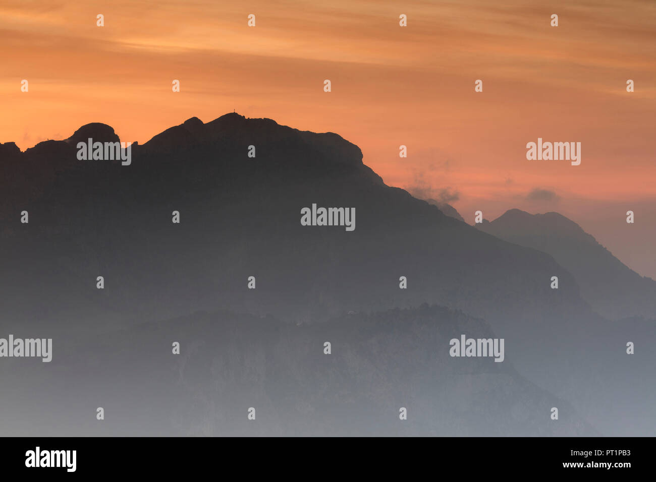 Silhouette of Monte Resegone at sunrise seen from Monte Coltignone ...