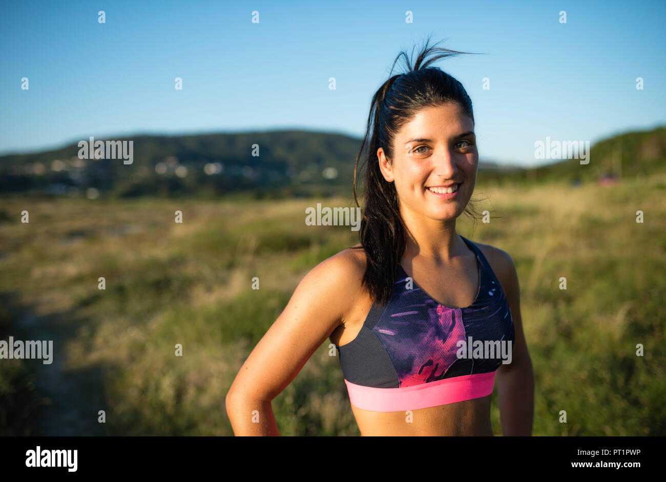 Portrait of a smiling jogger Stock Photo - Alamy