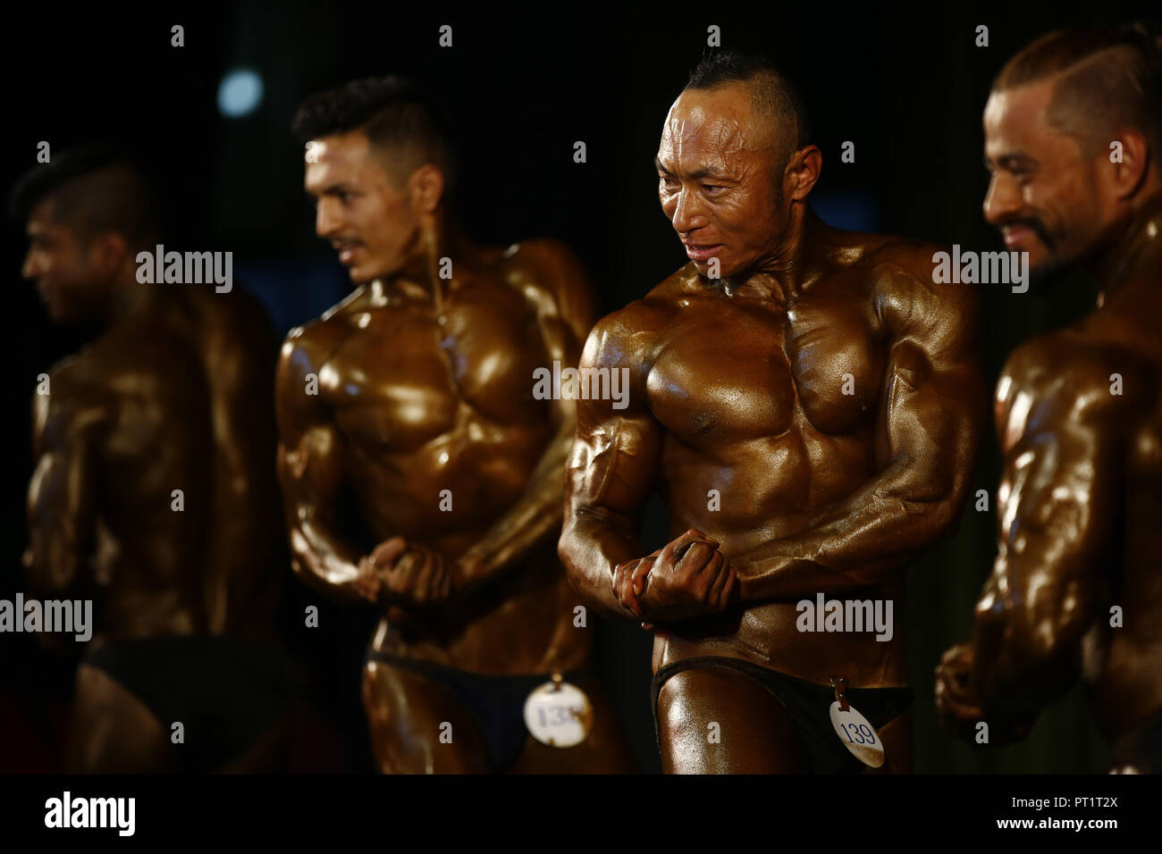 Kathmandu, Nepal. 5th Oct, 2018. Nepalese bodybuilders flex during the ...