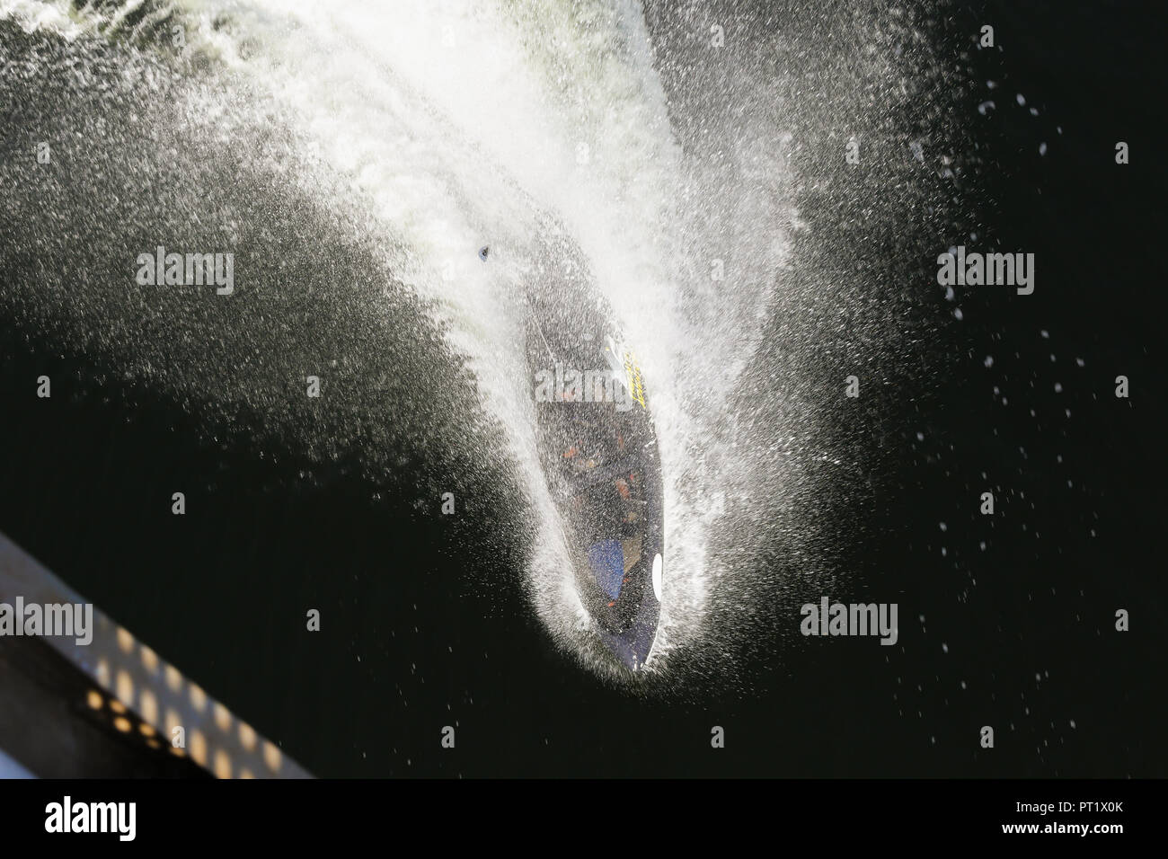 London's Royal Docks. UK 5 Oct 2018 - Man riding a whale shaped jet-ski ...