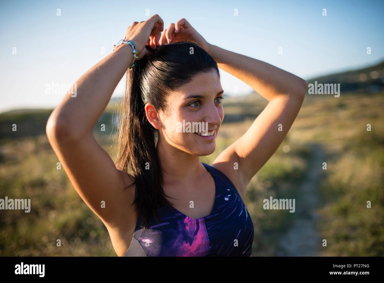 Portrait of a smiling jogger Stock Photo - Alamy