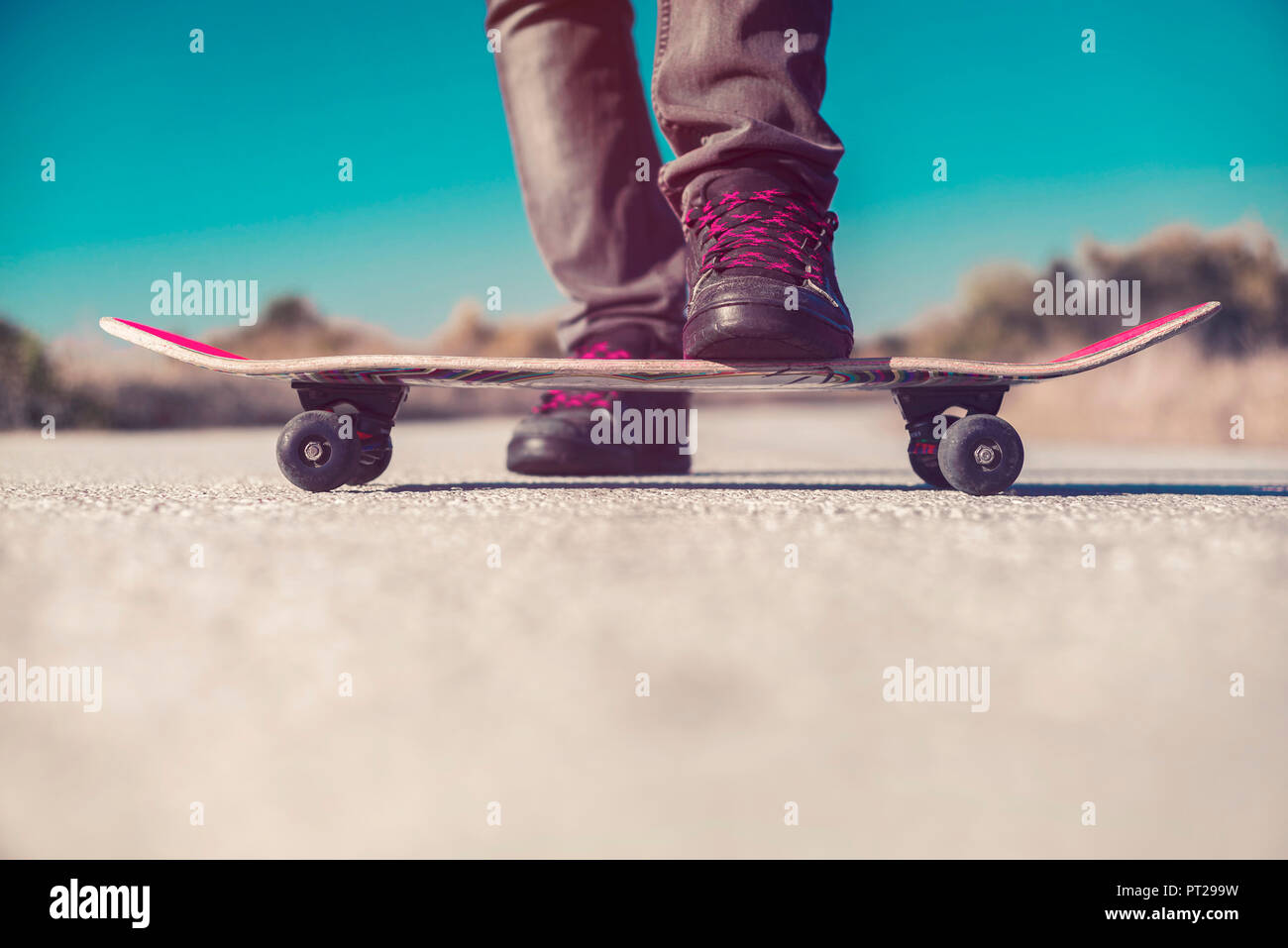 Skater one foot on skateboard Stock Photo - Alamy