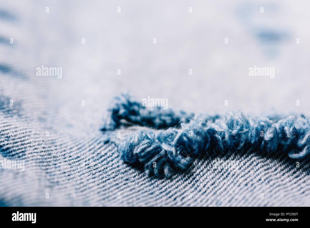 Denim Texture Of Torn Up Jeans Stock Photo: 221327508 - Alamy