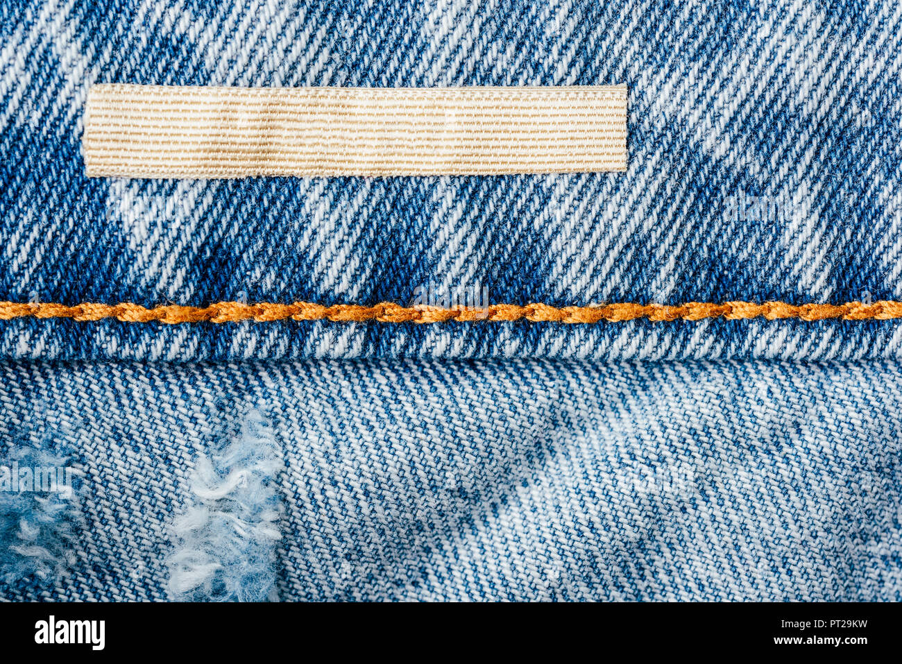Blank Label On Denim Jeans Texture Stock Photo - Alamy