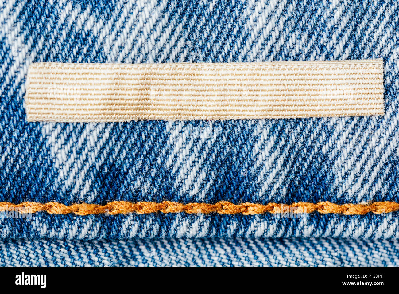 Blank Label On Denim Jeans Texture Stock Photo - Alamy