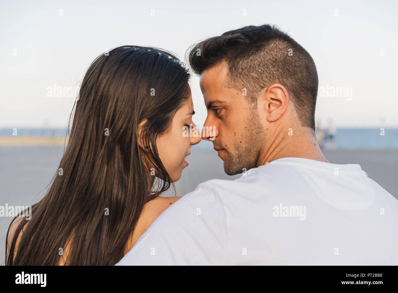 Young urban couple falling in love, kissing Stock Photo - Alamy