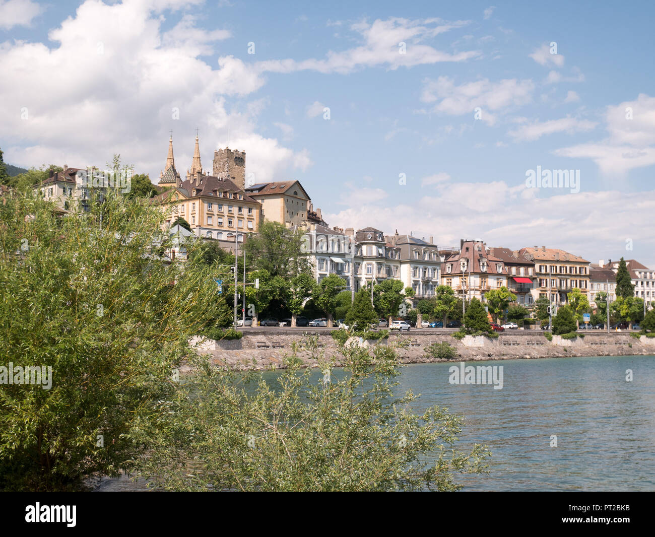 Neuchatel waterfront with the castle showing through and trees in the ...